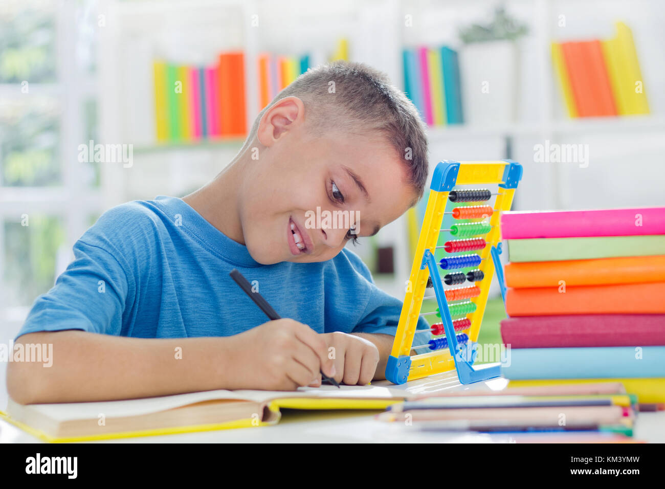 smiling little school child study Stock Photo - Alamy