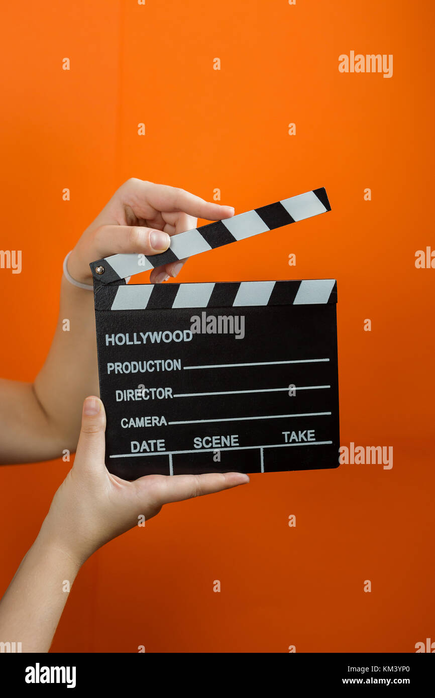 movie clapper on orange background, cinema concept Stock Photo - Alamy