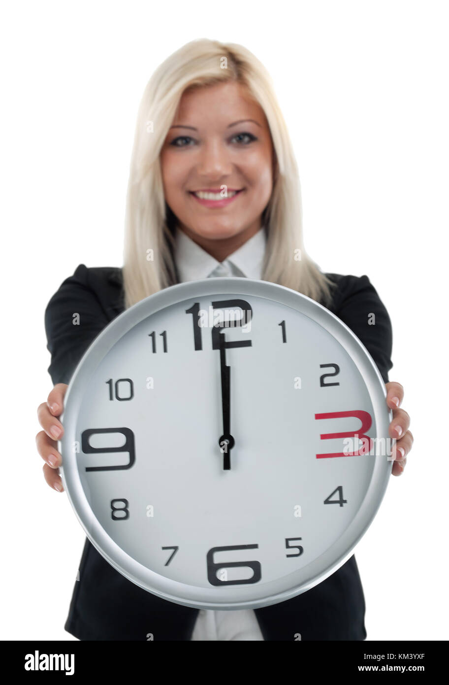blonde woman holding watch Stock Photo - Alamy
