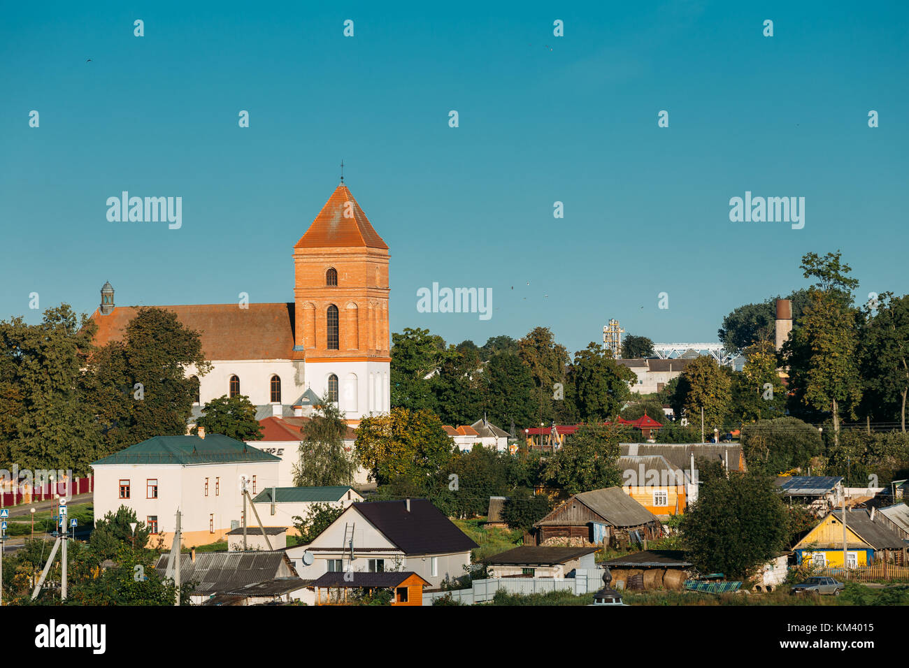 Mir, Belarus. Landscape Of Village Houses And Saint Nicolas Roman ...