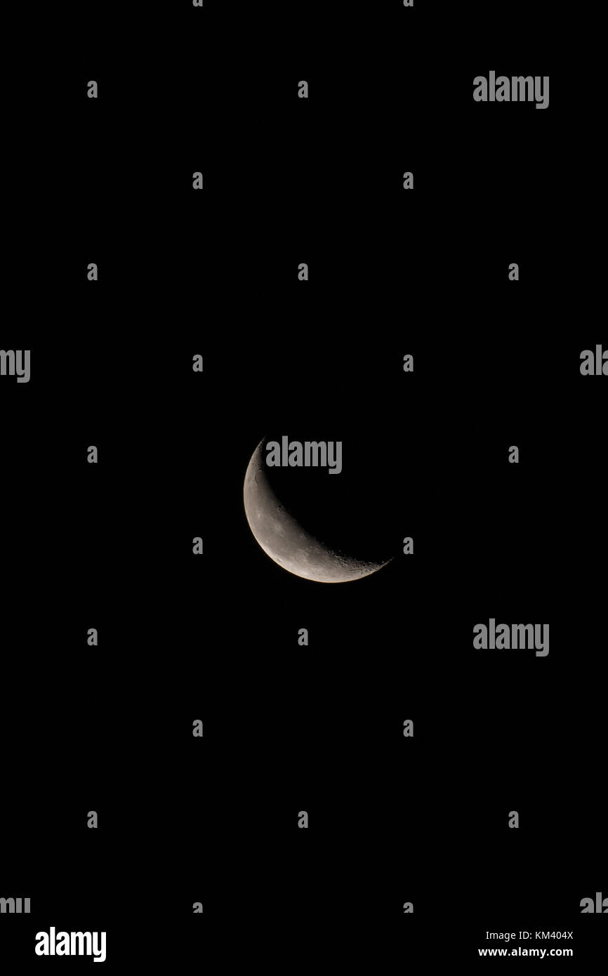 Waning crescent Moon in vertical orientation with room top and bottom ...