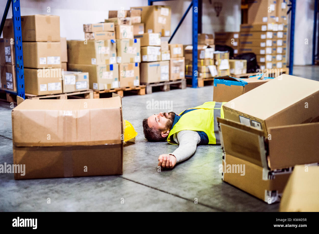 Warehouse worker after an accident in a warehouse Stock Photo - Alamy