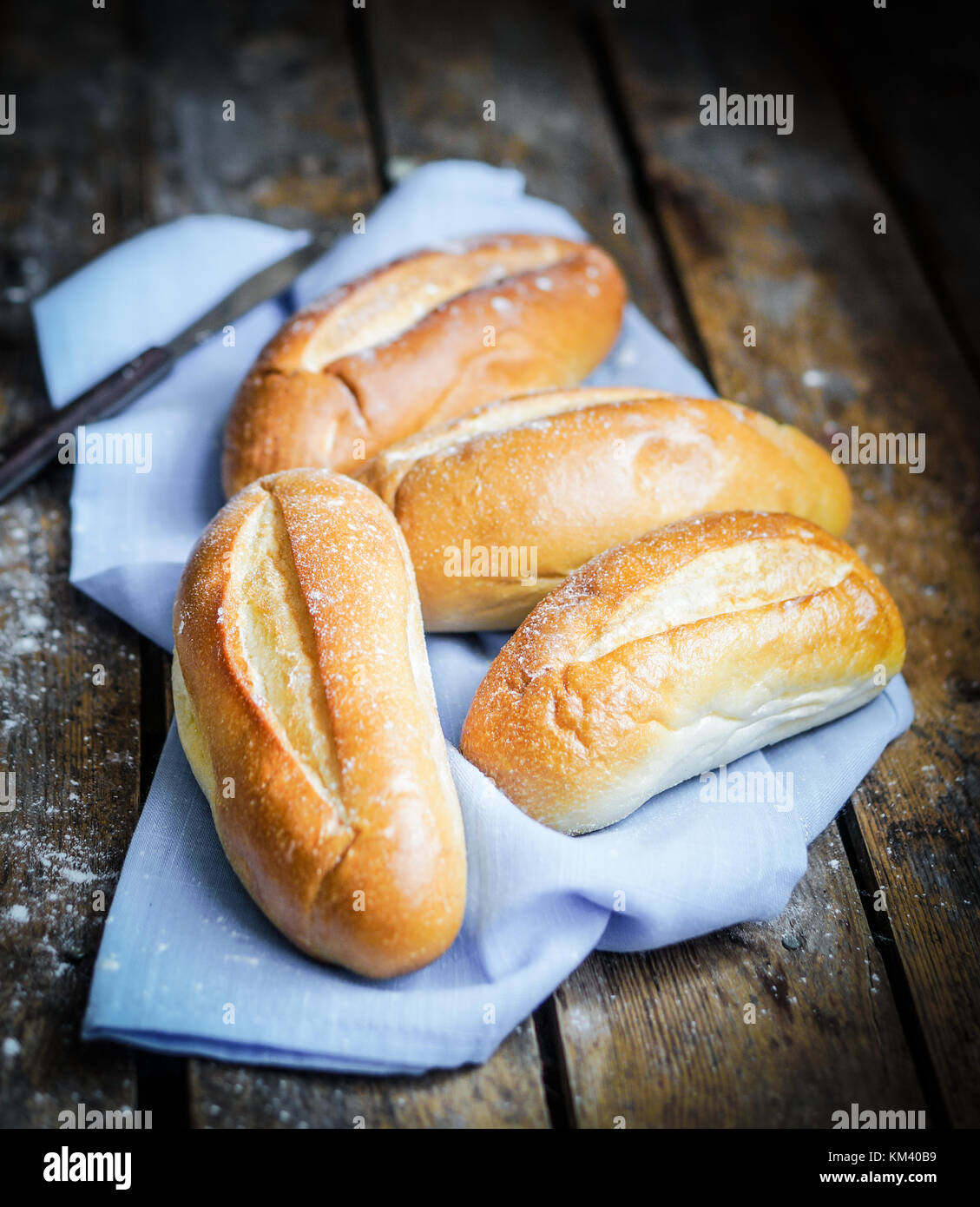 Bread Rolls On Rustic Wooden Background Stock Photo - Alamy