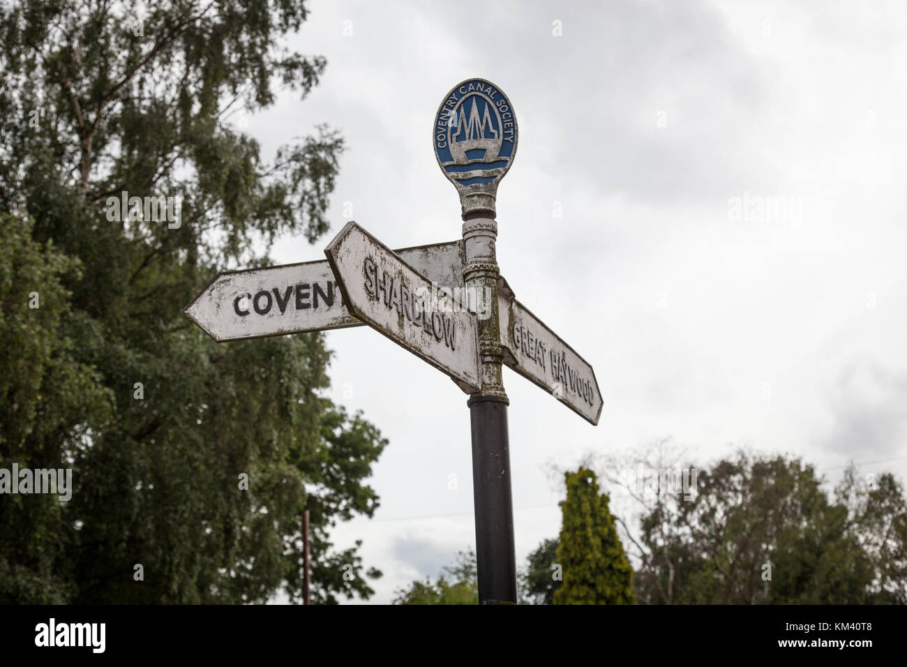 Old metal signpost of the Coventry Canal Society at a junction of the ...