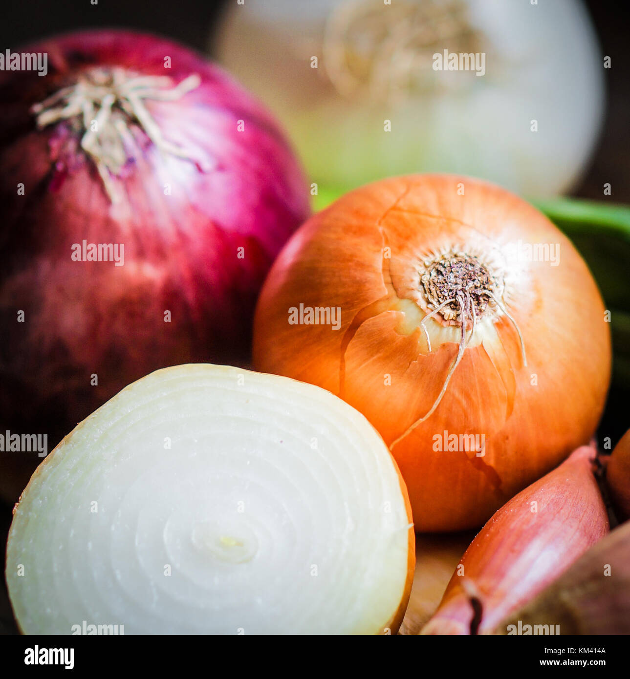 Colorful Onions On Rustic Wooden Background Stock Photo - Alamy