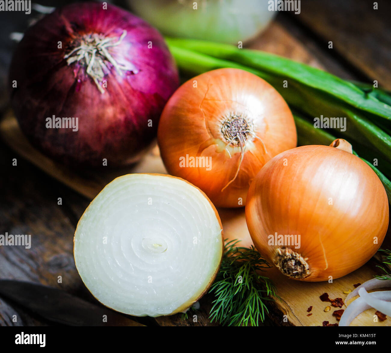 Colorful Onions On Rustic Wooden Background Stock Photo - Alamy