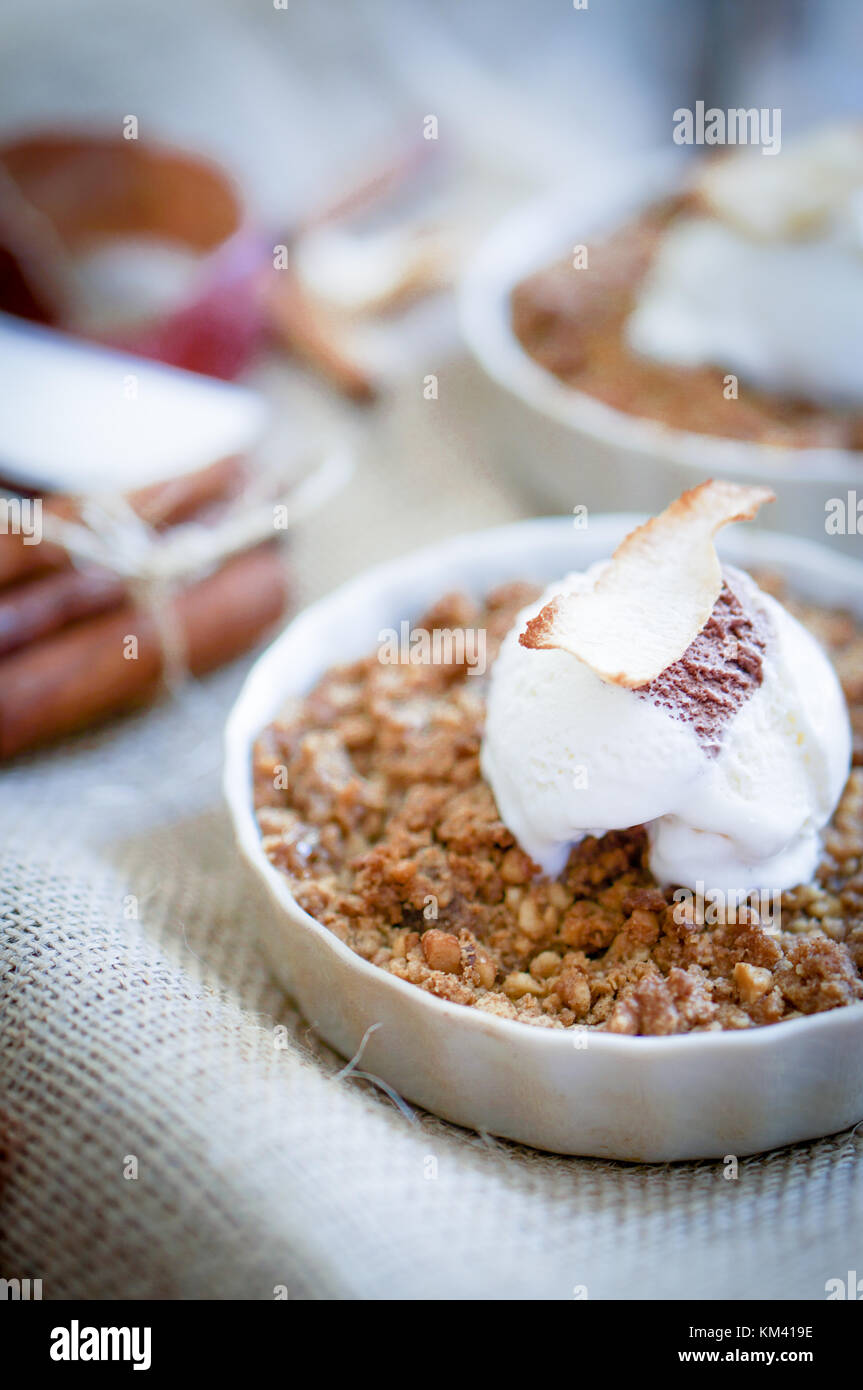 Apple Crumble Dessert With Cinnamon And Vanilla Ice Cream On Wooden ...