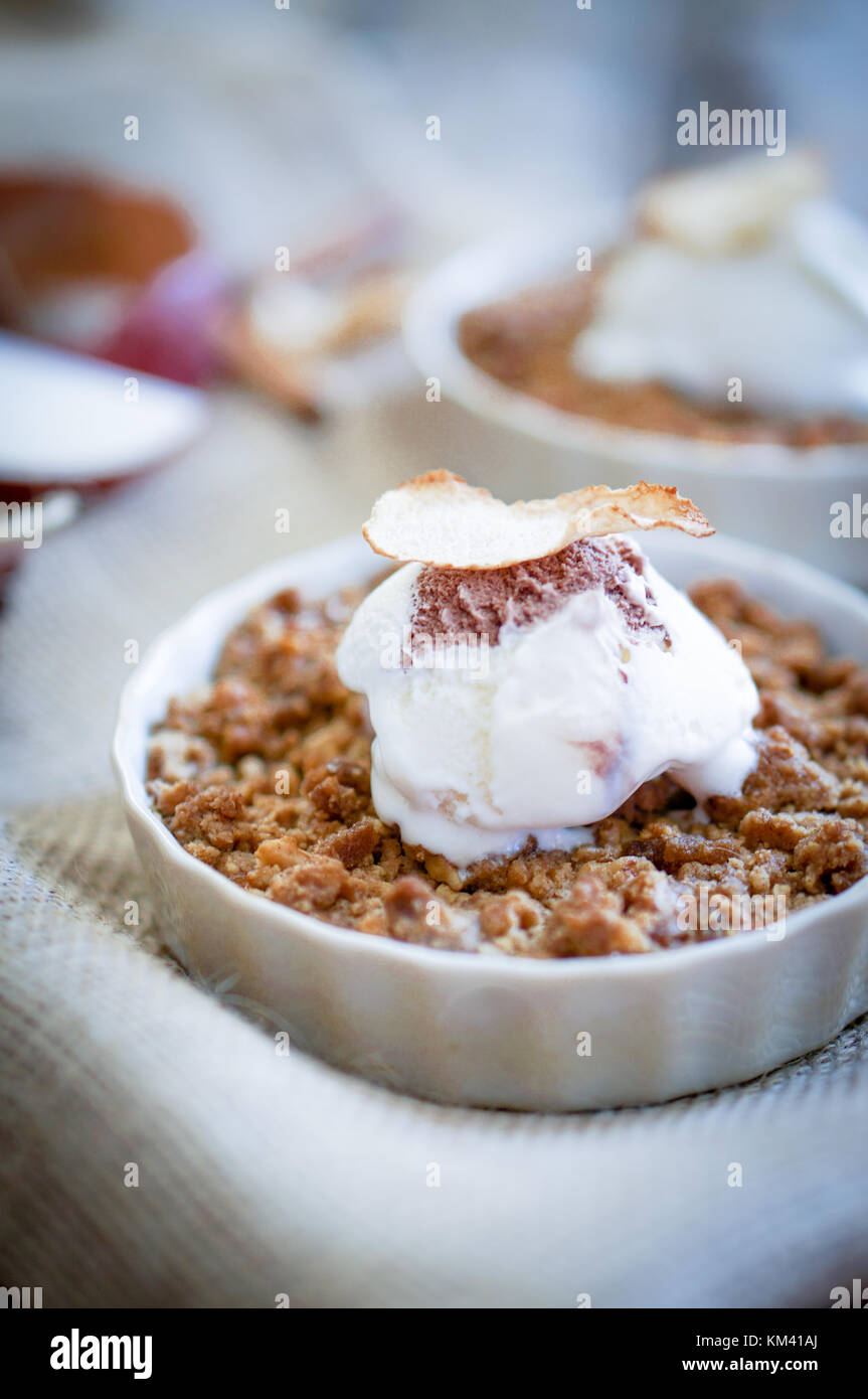 Apple Crumble Dessert With Cinnamon And Vanilla Ice Cream On Wooden ...
