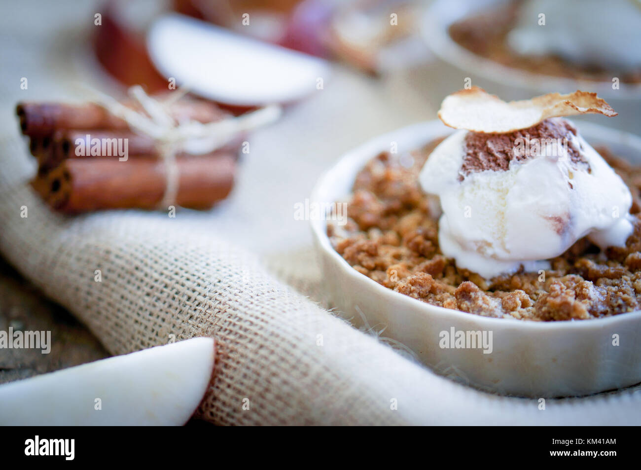 Apple Crumble Dessert With Cinnamon And Vanilla Ice Cream On Wooden ...