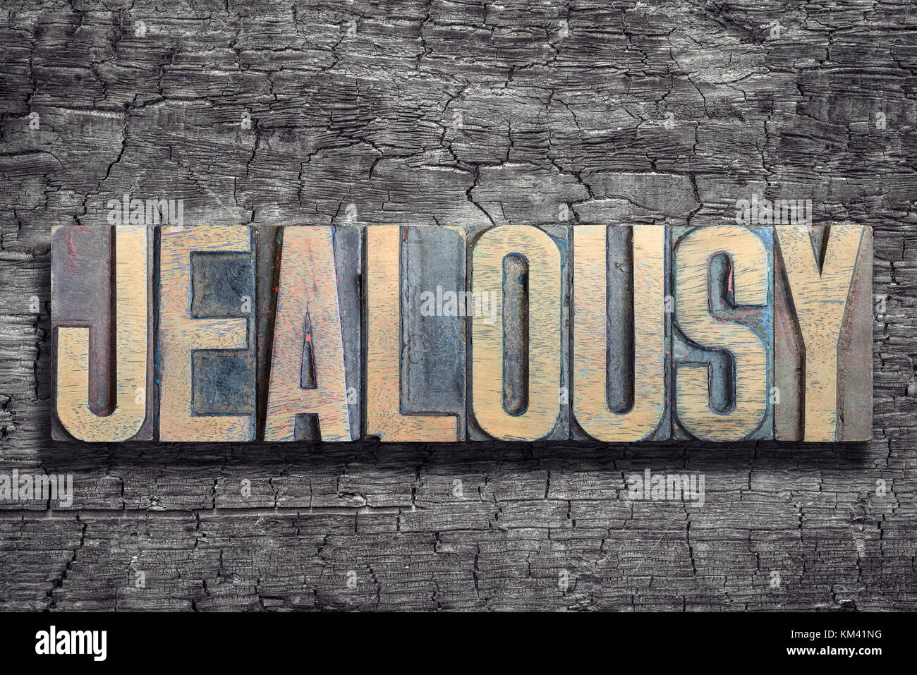 jealousy word made from vintage letterpress type on burned wood ...