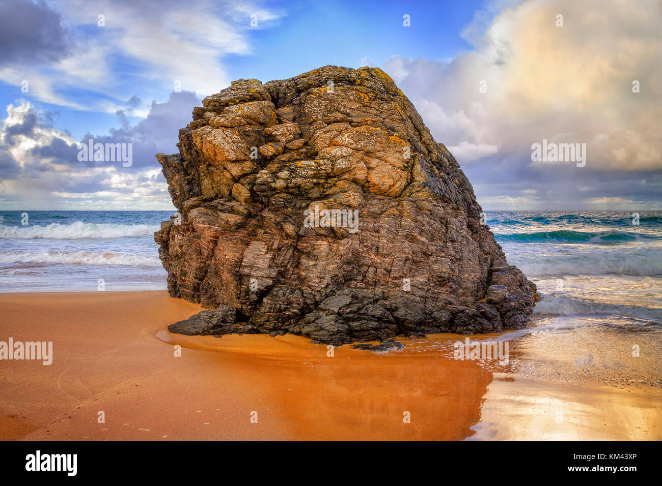 Rock on sandy beach Stock Photo - Alamy
