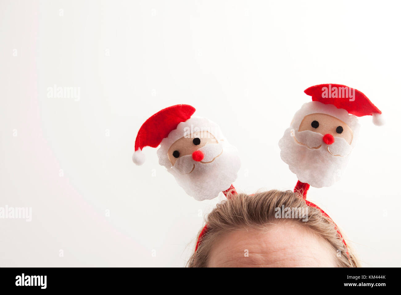 Festive christmas Santa headband on a female head Stock Photo - Alamy