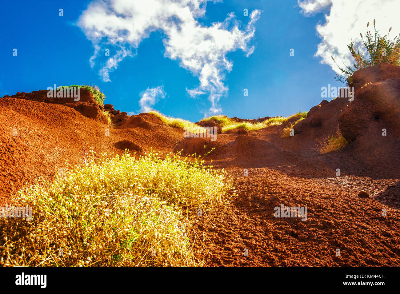 Red cliff blue sky Stock Photo - Alamy