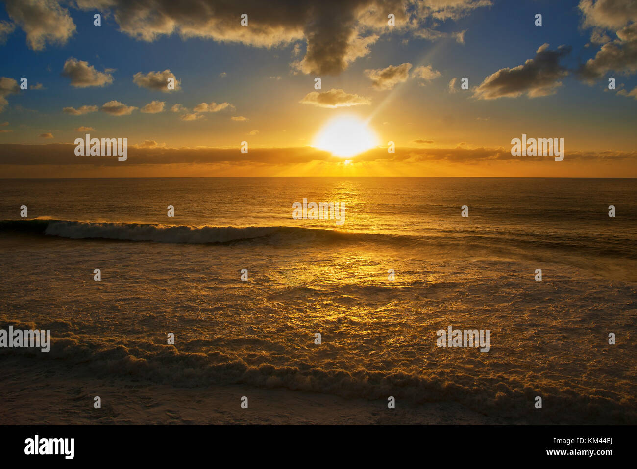 Ocean wave during sunset Stock Photo - Alamy