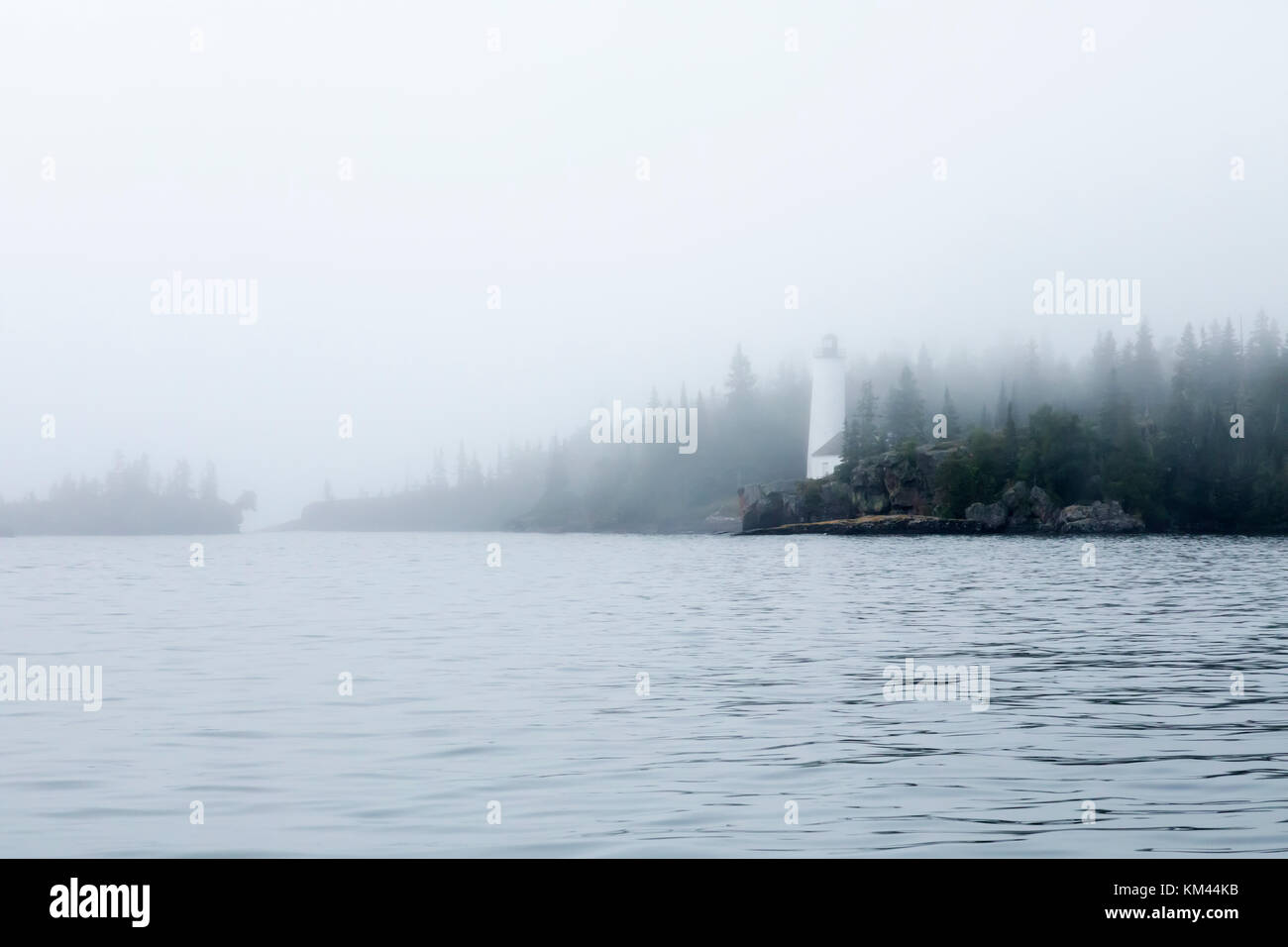 Rock Harbor Lighthouse in fog, Isle Royal National Park Stock Photo - Alamy