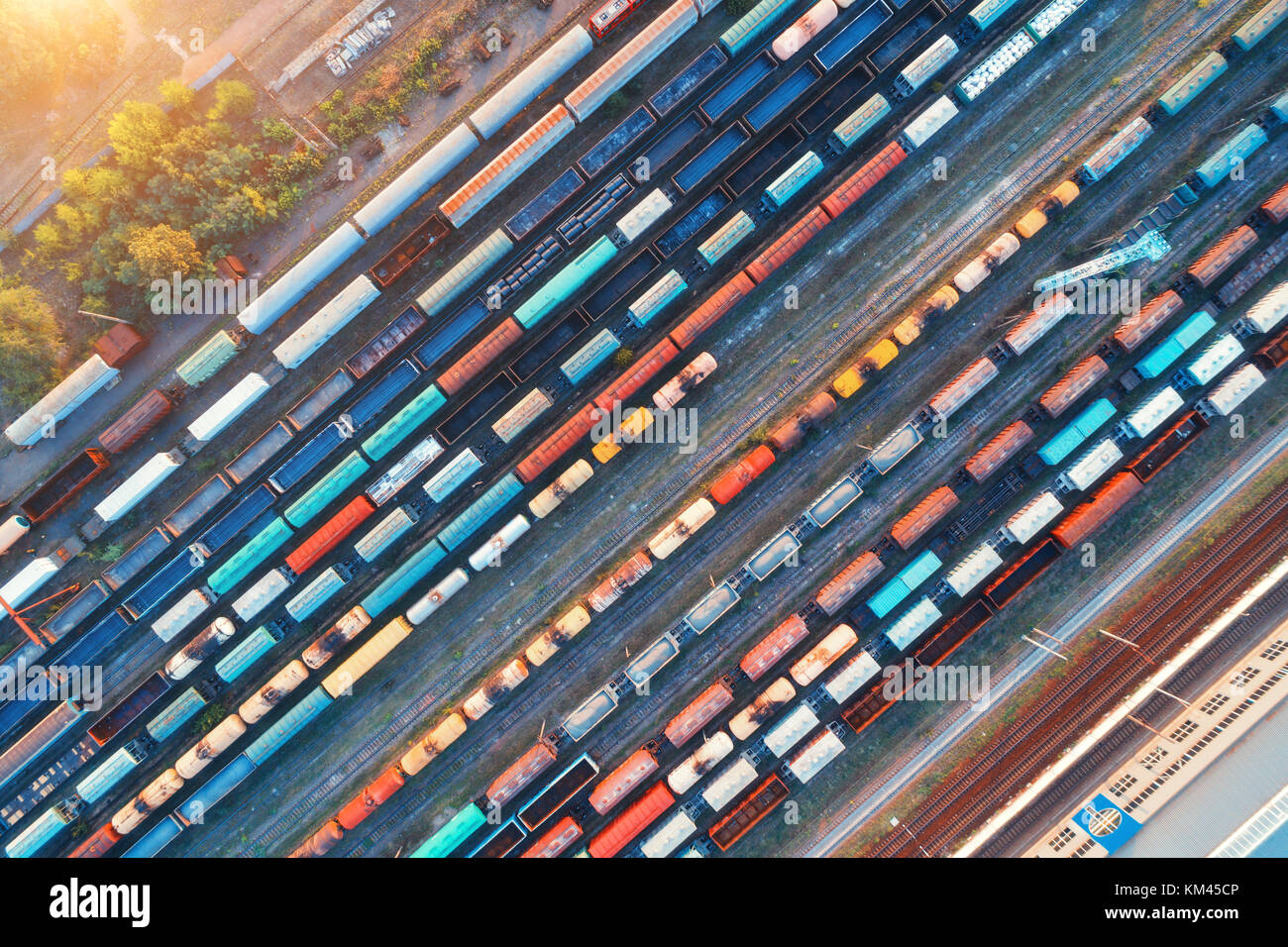 Top view of colorful cargo trains. Aerial view from flying drone of ...