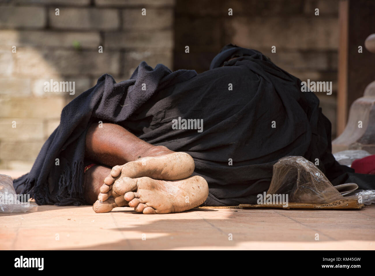 Homeless man in the UNESCO temples of Bhaktapur, Nepal Stock Photo - Alamy