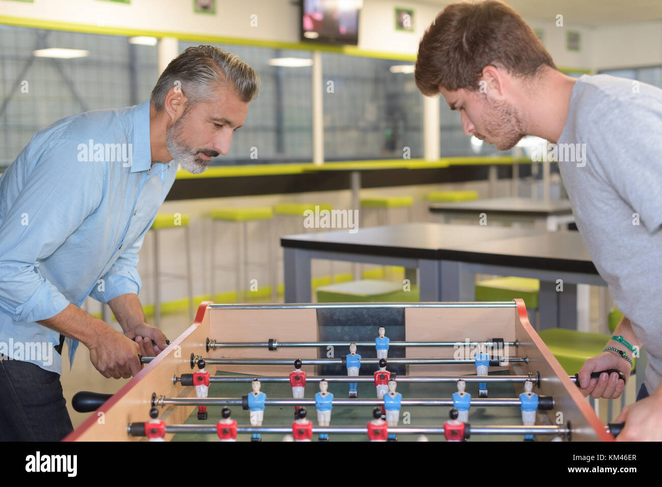 man playing table football Stock Photo - Alamy
