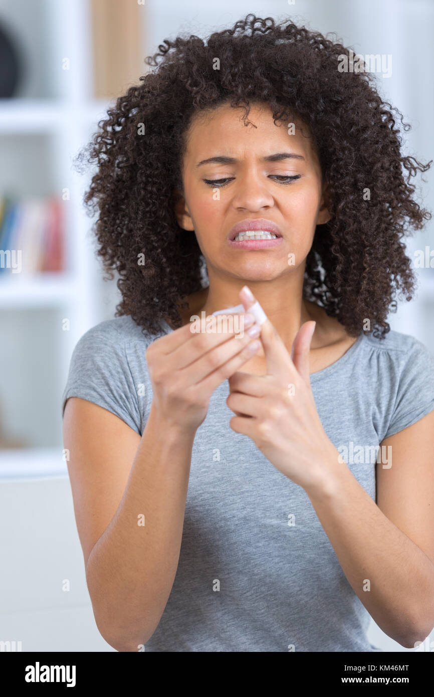 females injured finger Stock Photo - Alamy