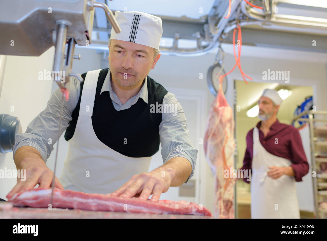 butcher cuts meat Stock Photo - Alamy