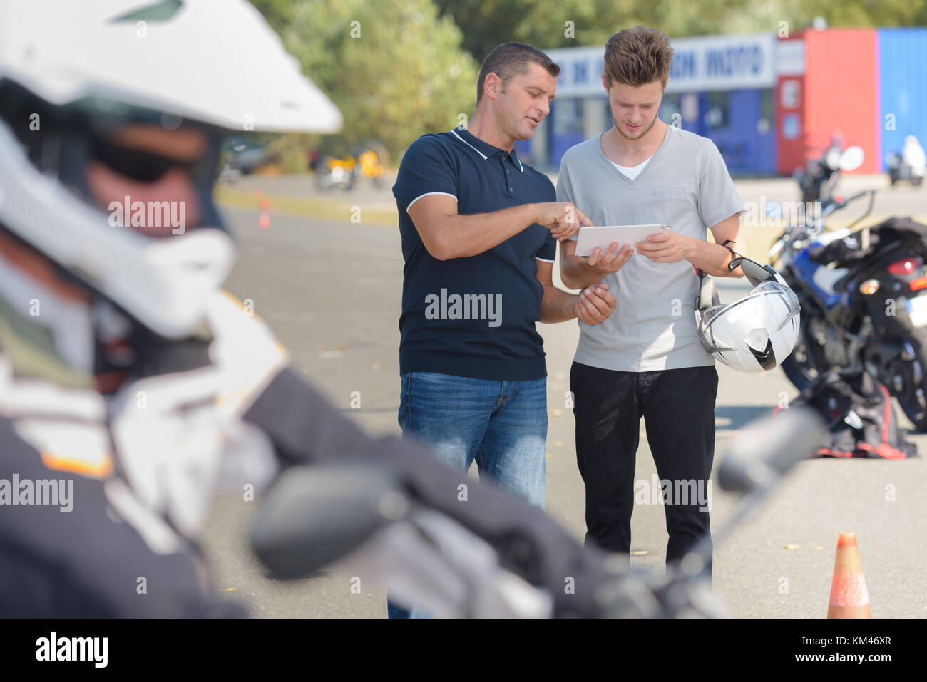 student and teacher of motorbike riding school Stock Photo - Alamy