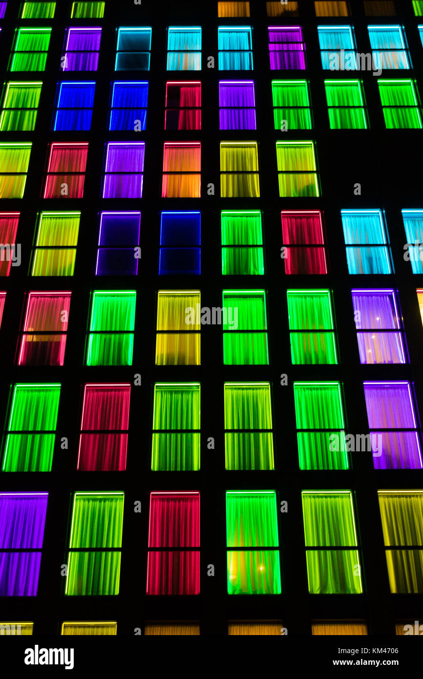 Colored windows texture. Windows illuminated by neon lights background ...