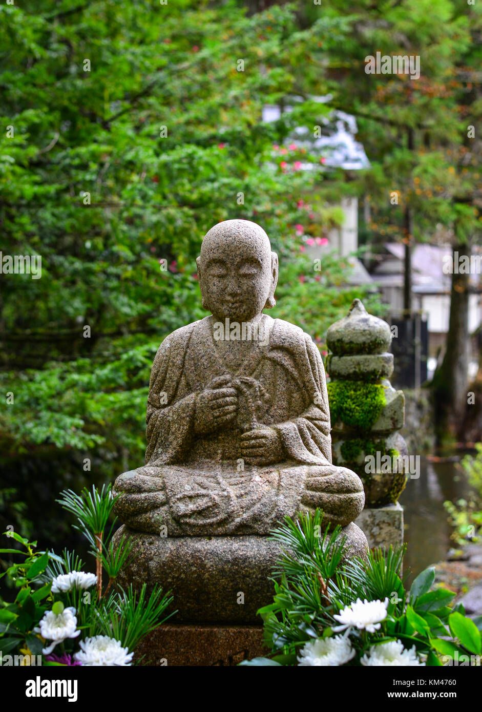 A stone Buddha at ancient cemetery on Sacred Mount Koya (Koyasan) in ...