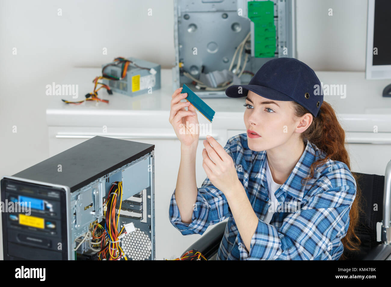young woman fixing a computer hard drive Stock Photo - Alamy