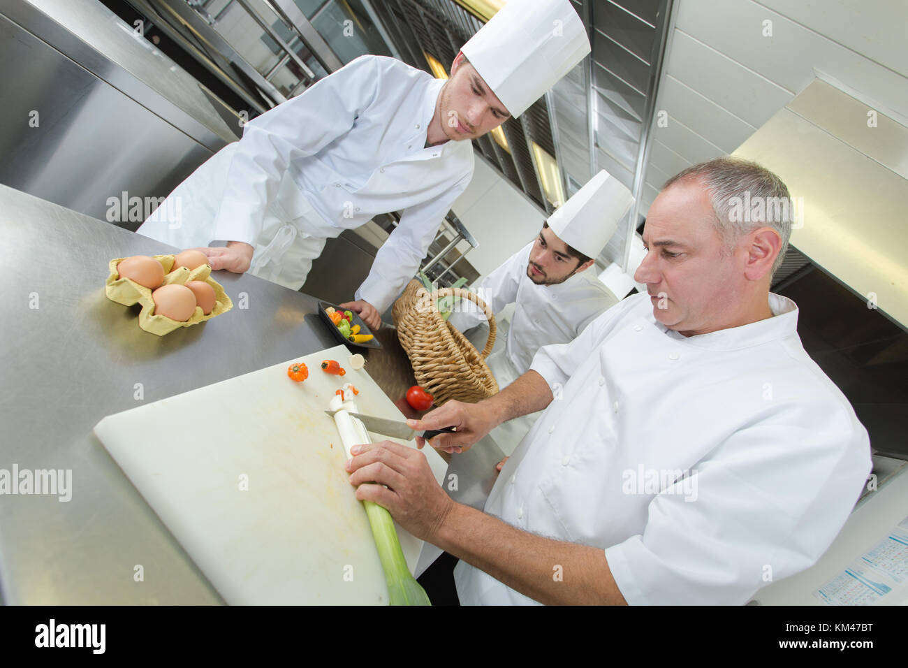trainee chef learning chop veggies Stock Photo - Alamy