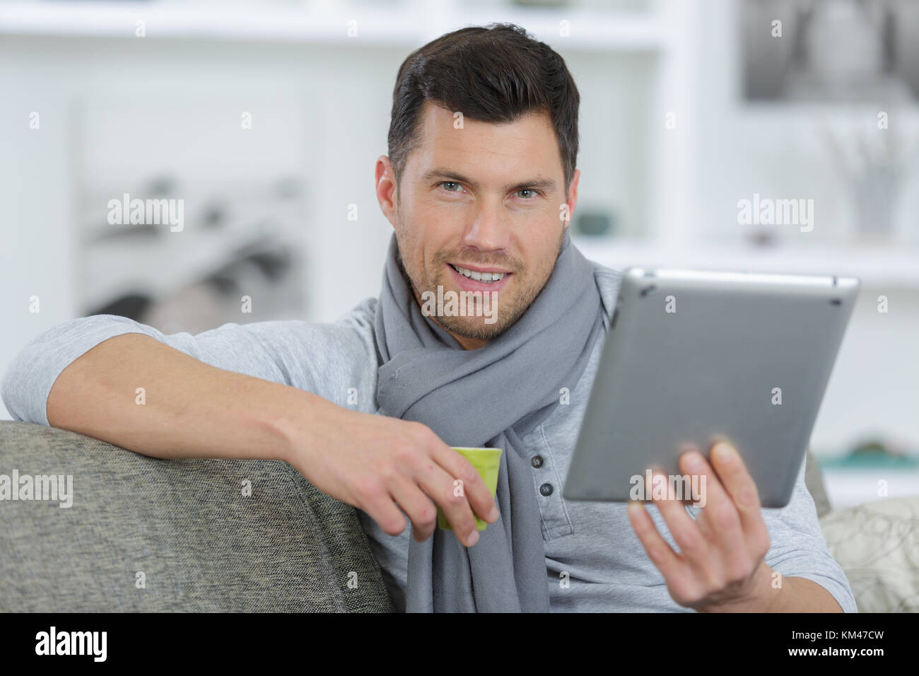 man using an apple tablet Stock Photo - Alamy