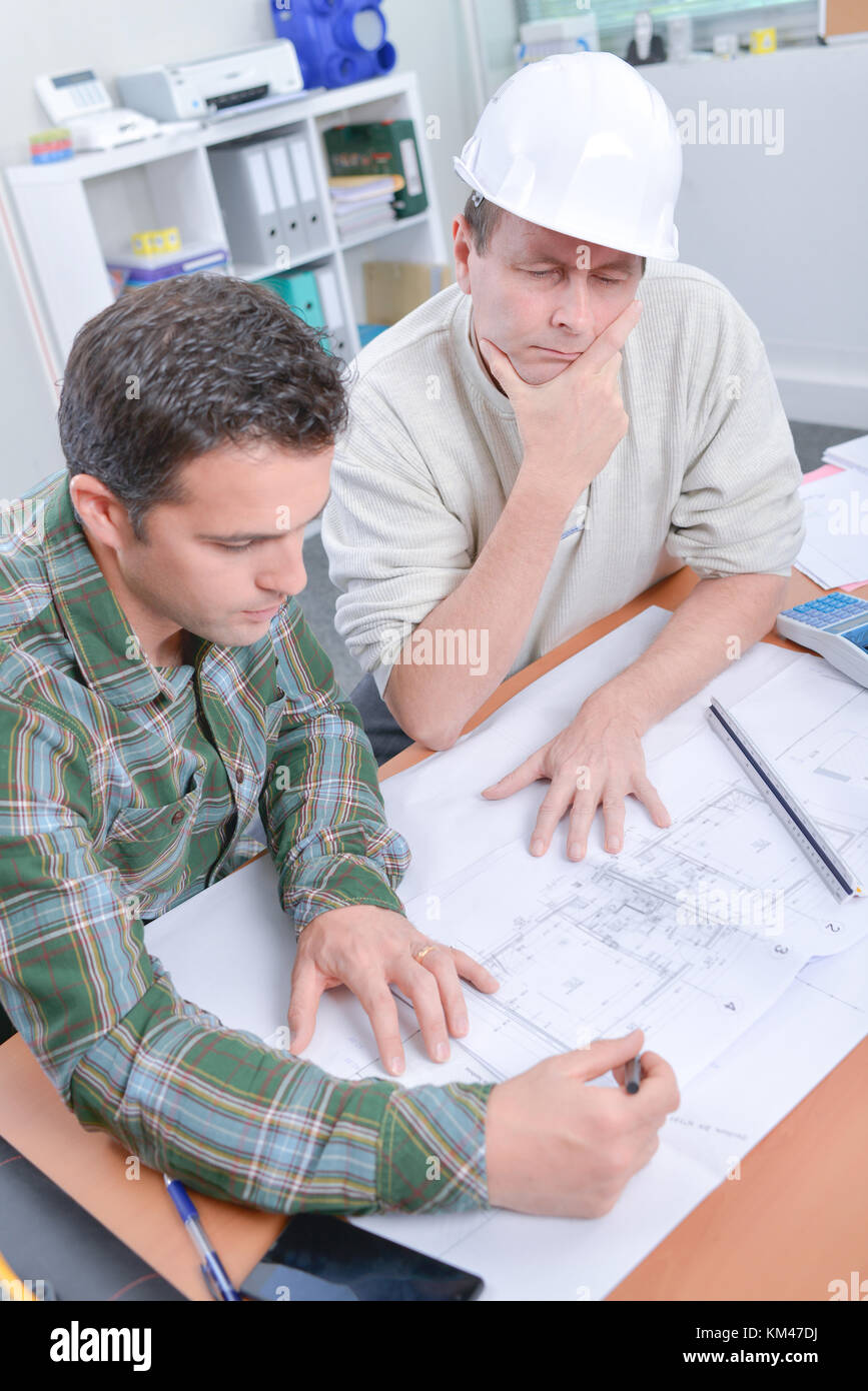 Architects going over some details Stock Photo - Alamy