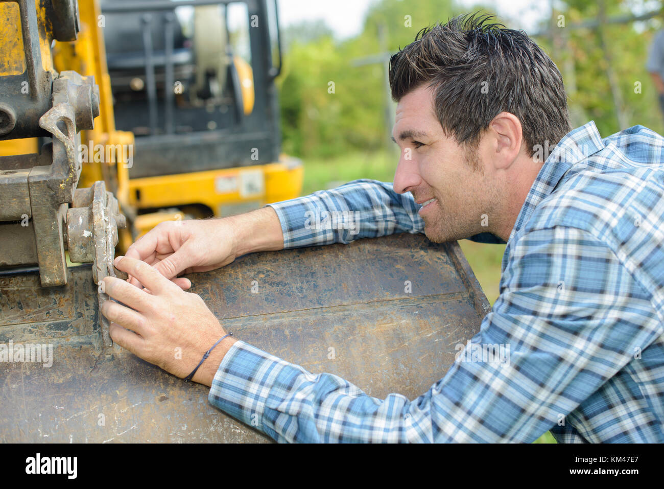Male operating excavator hi-res stock photography and images - Alamy