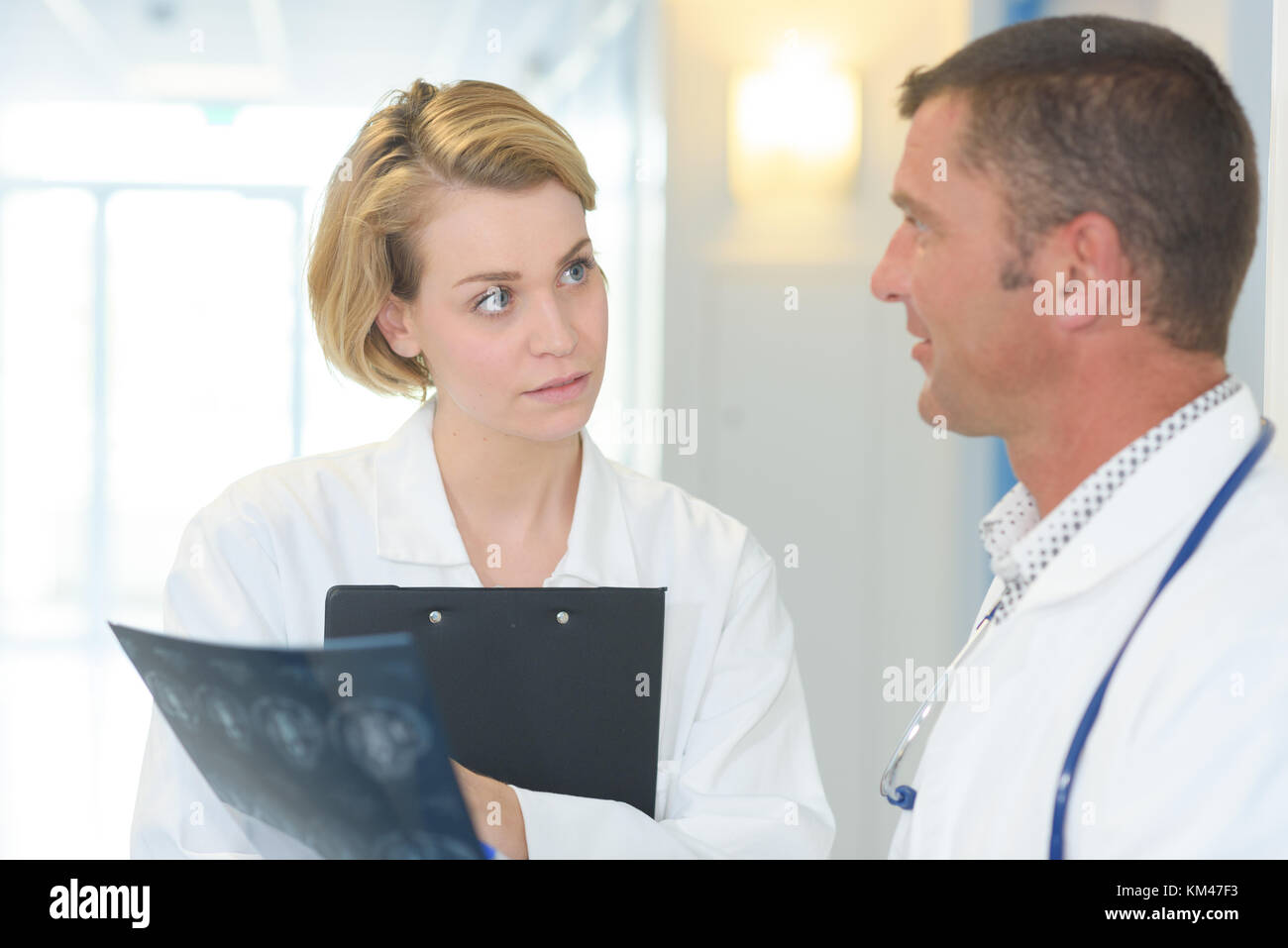 doctor talking to female trainee Stock Photo - Alamy