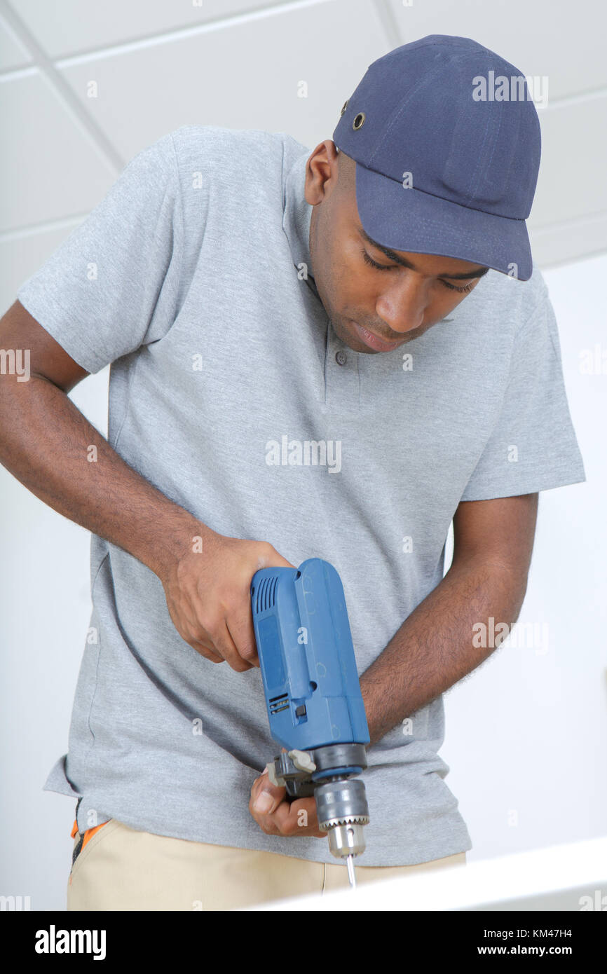 Man using electrical drill Stock Photo - Alamy