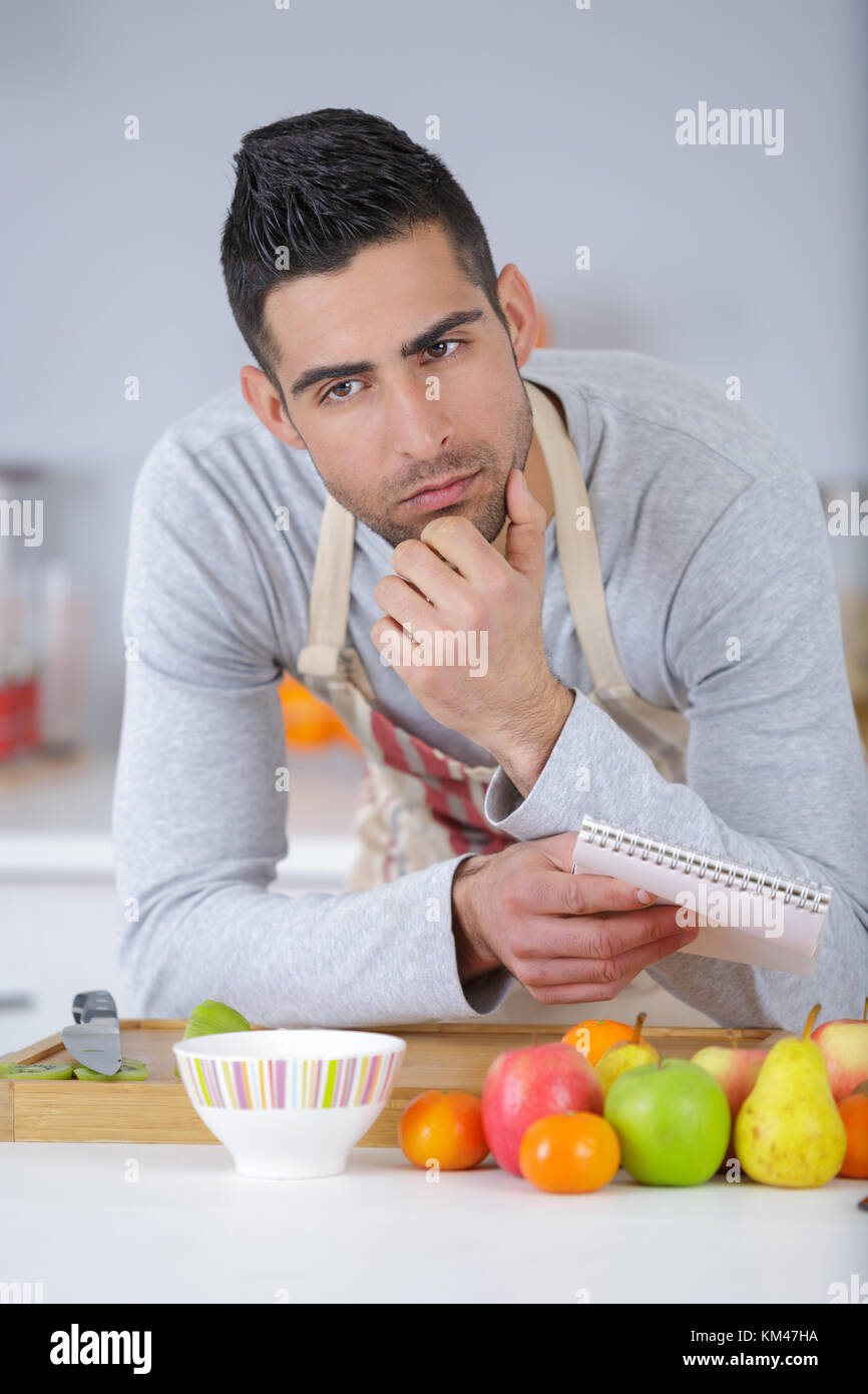man thinking of dessert ideas from fruits Stock Photo - Alamy