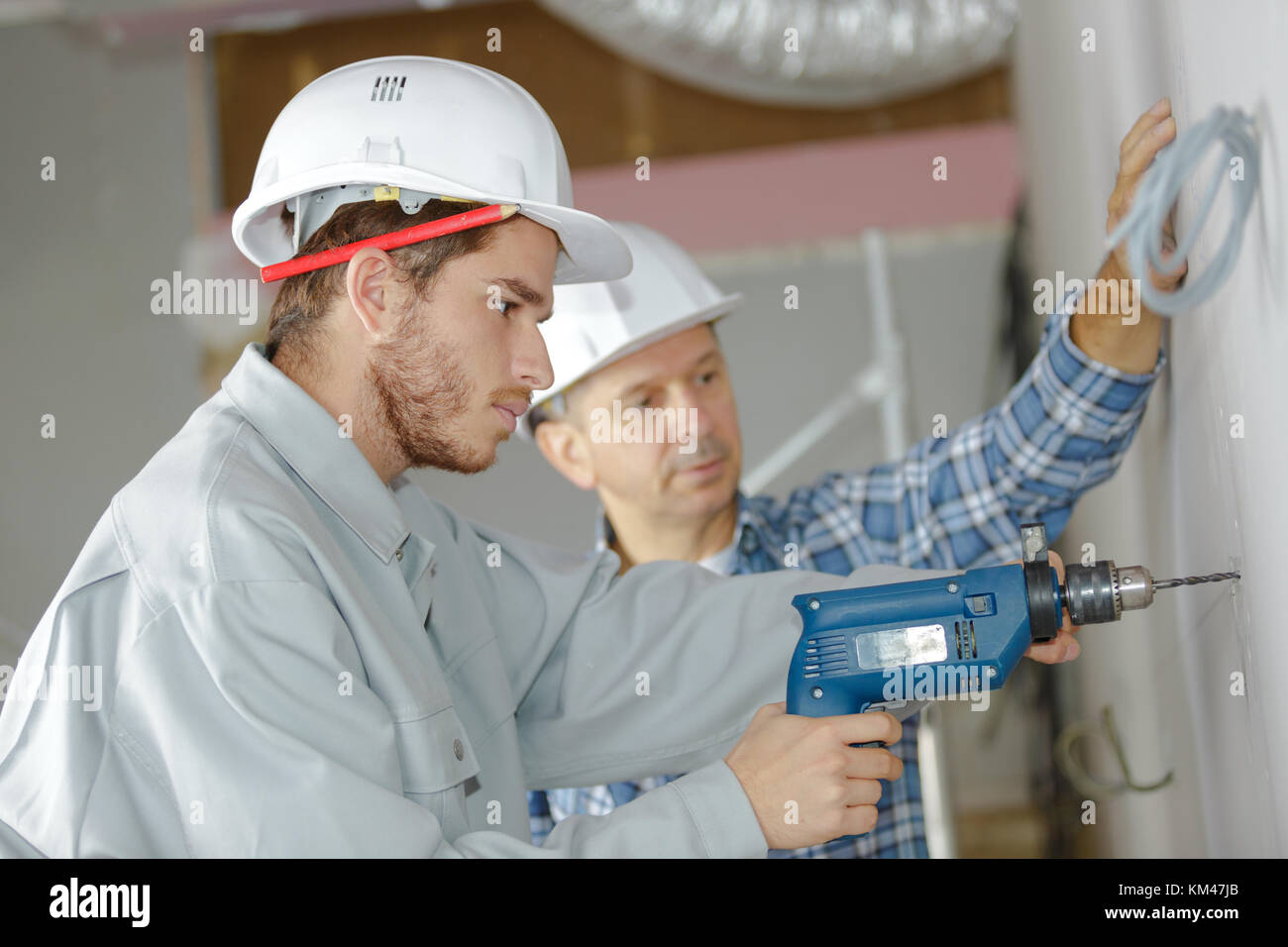 Drilling white wall drill close hi-res stock photography and images - Alamy