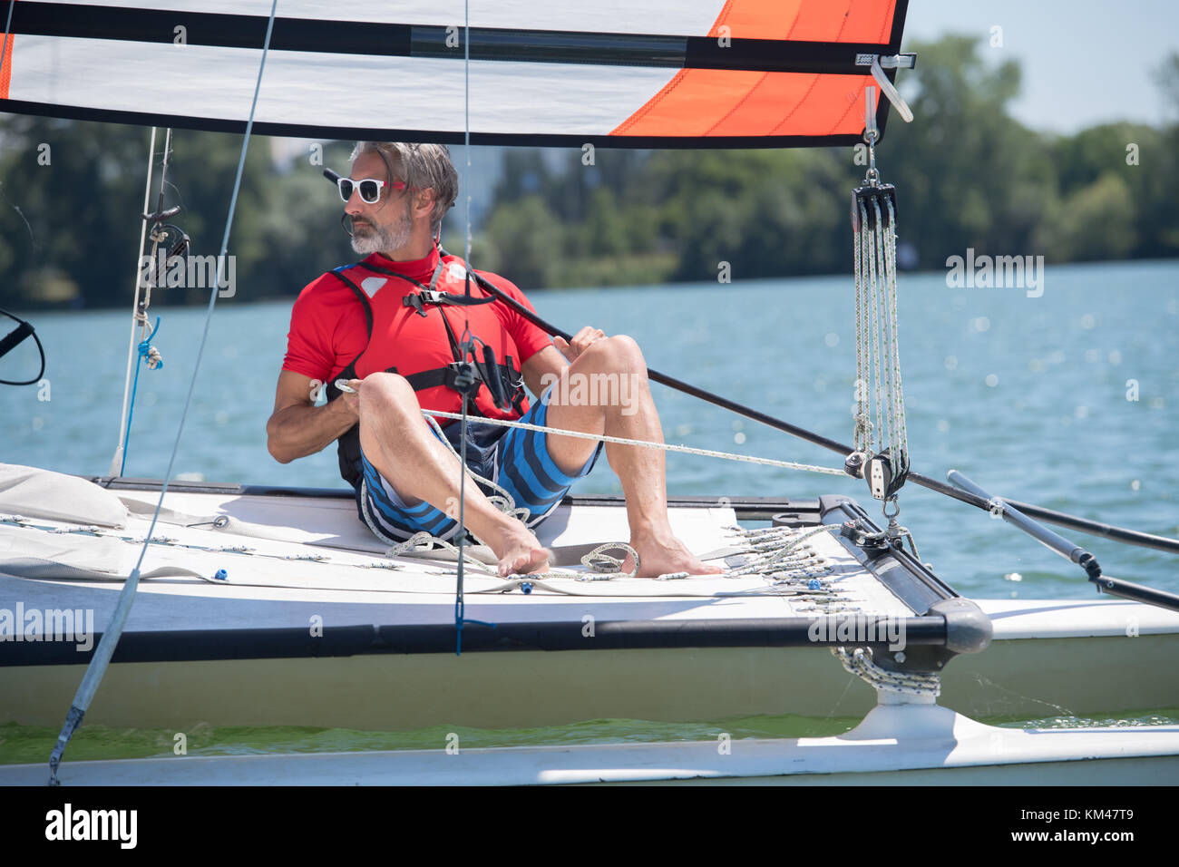 man in a sailing vessel Stock Photo - Alamy