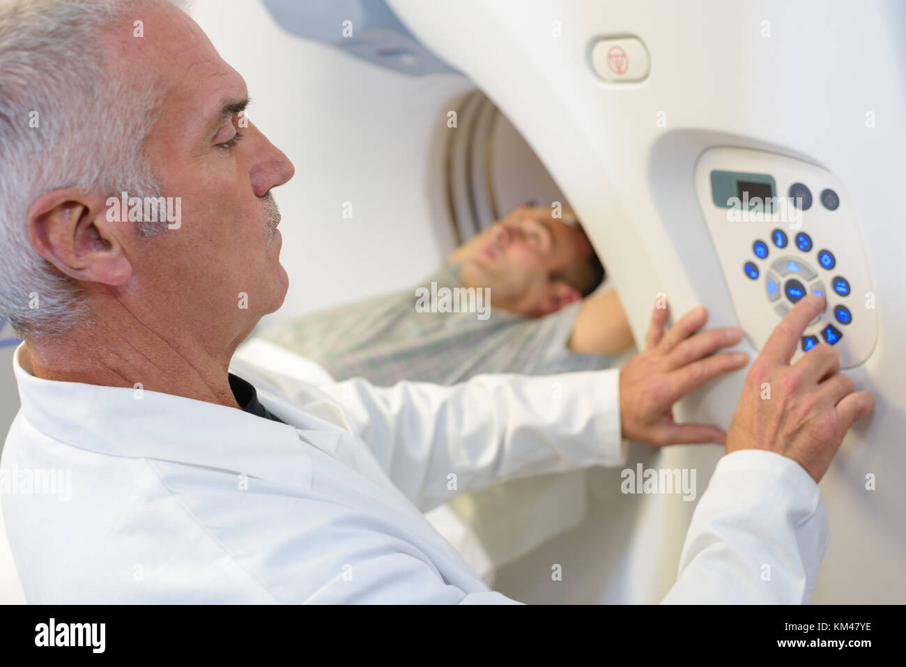 pressing MRI buttons Stock Photo - Alamy