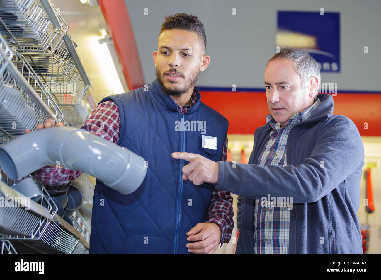 man selling plastic pipes Stock Photo - Alamy