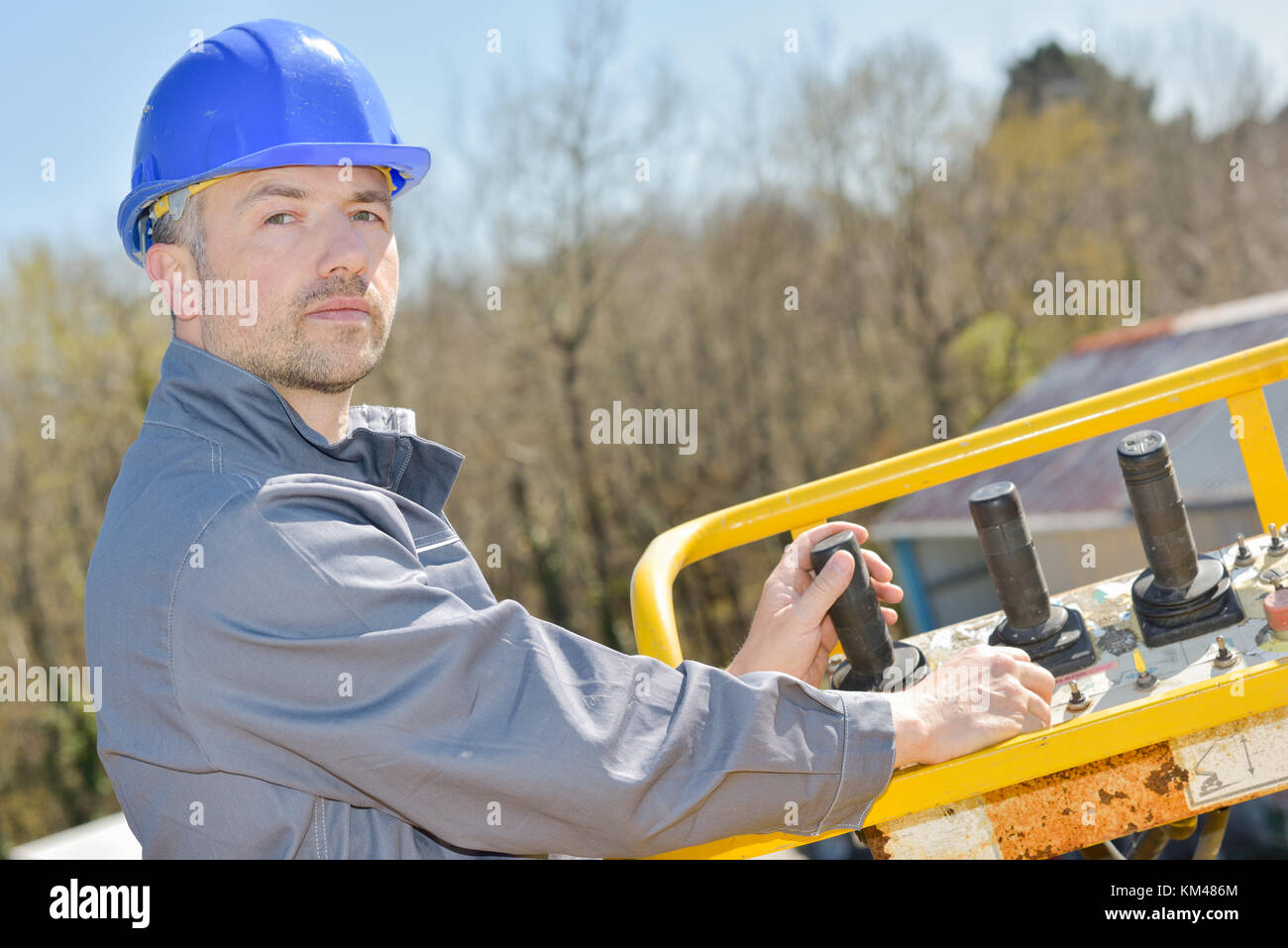 manual worker operating crane Stock Photo - Alamy