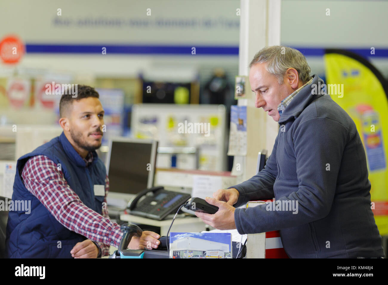 man paying for delivery with credit card and payment terminal Stock ...