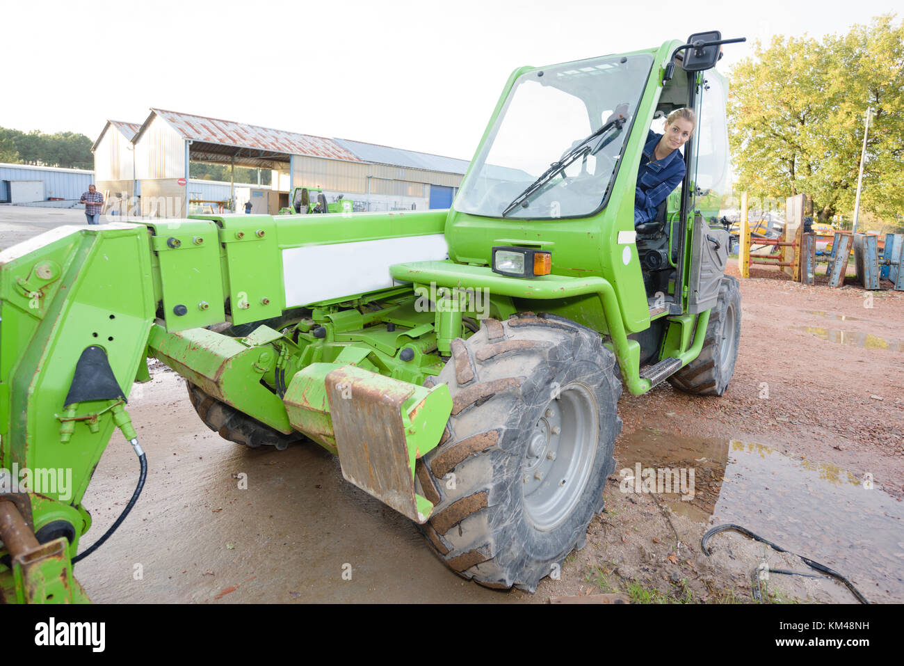 Woman driving plant machinery Stock Photo - Alamy