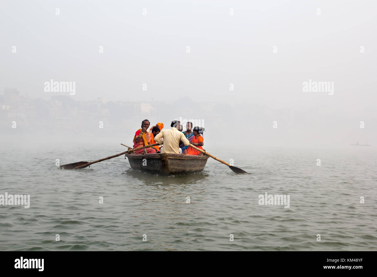 Indian people enjoying boat ride on the holy river ganges, banaras ...