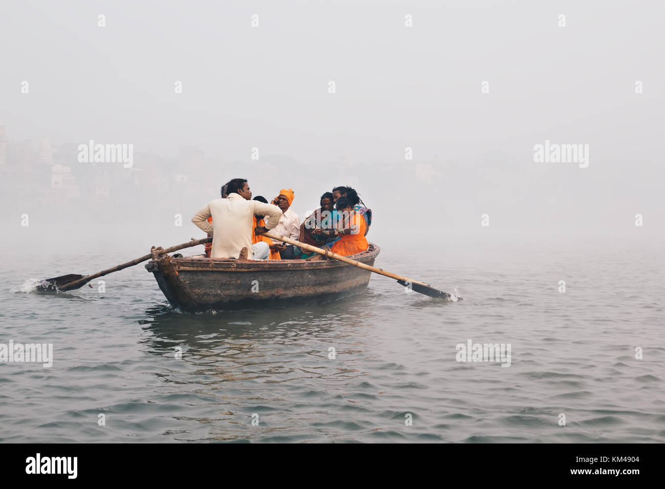 Indian people enjoying boat ride on the holy river ganges, banaras ...