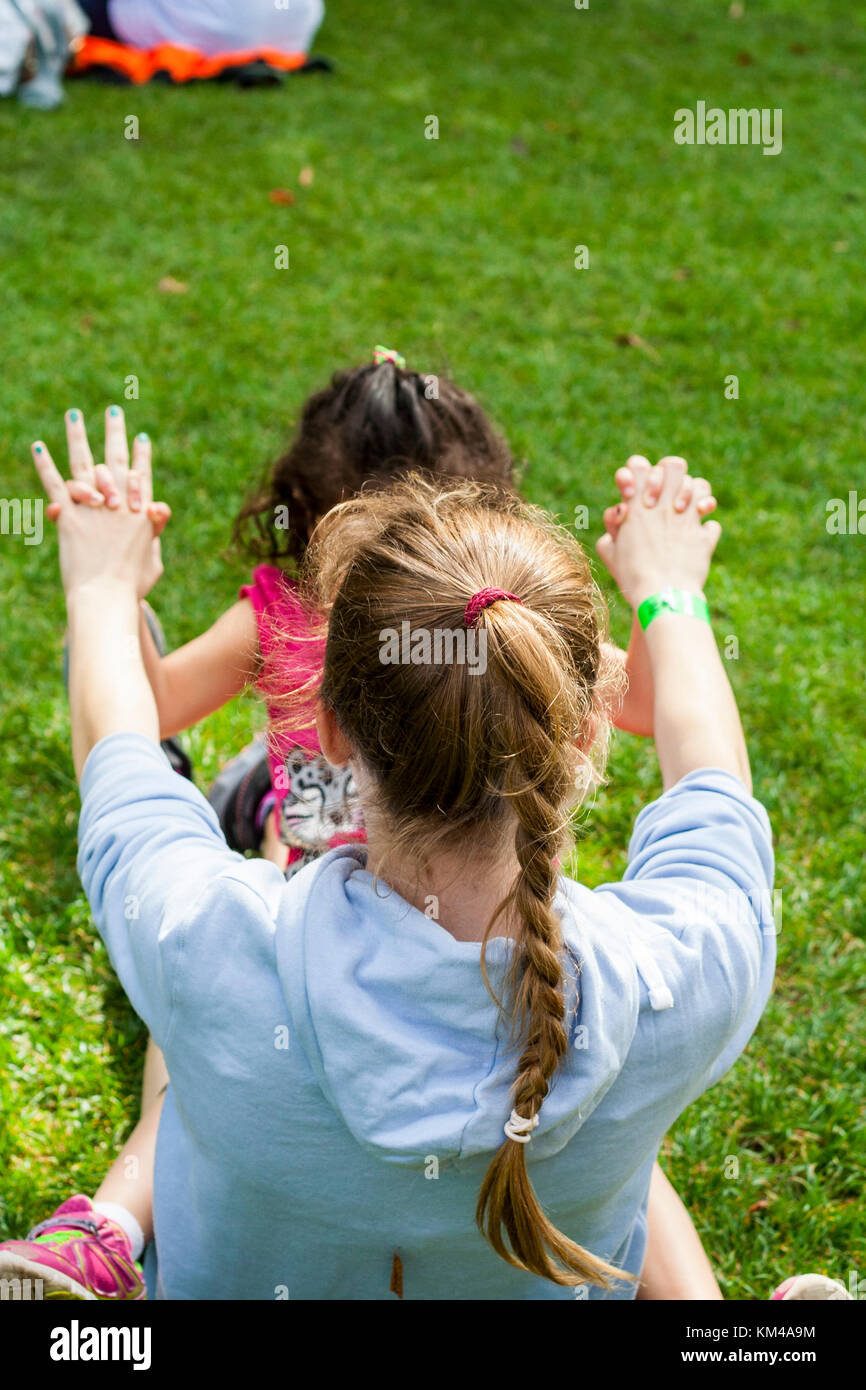 Children playing row row your boat in the garden, childrens games Stock ...