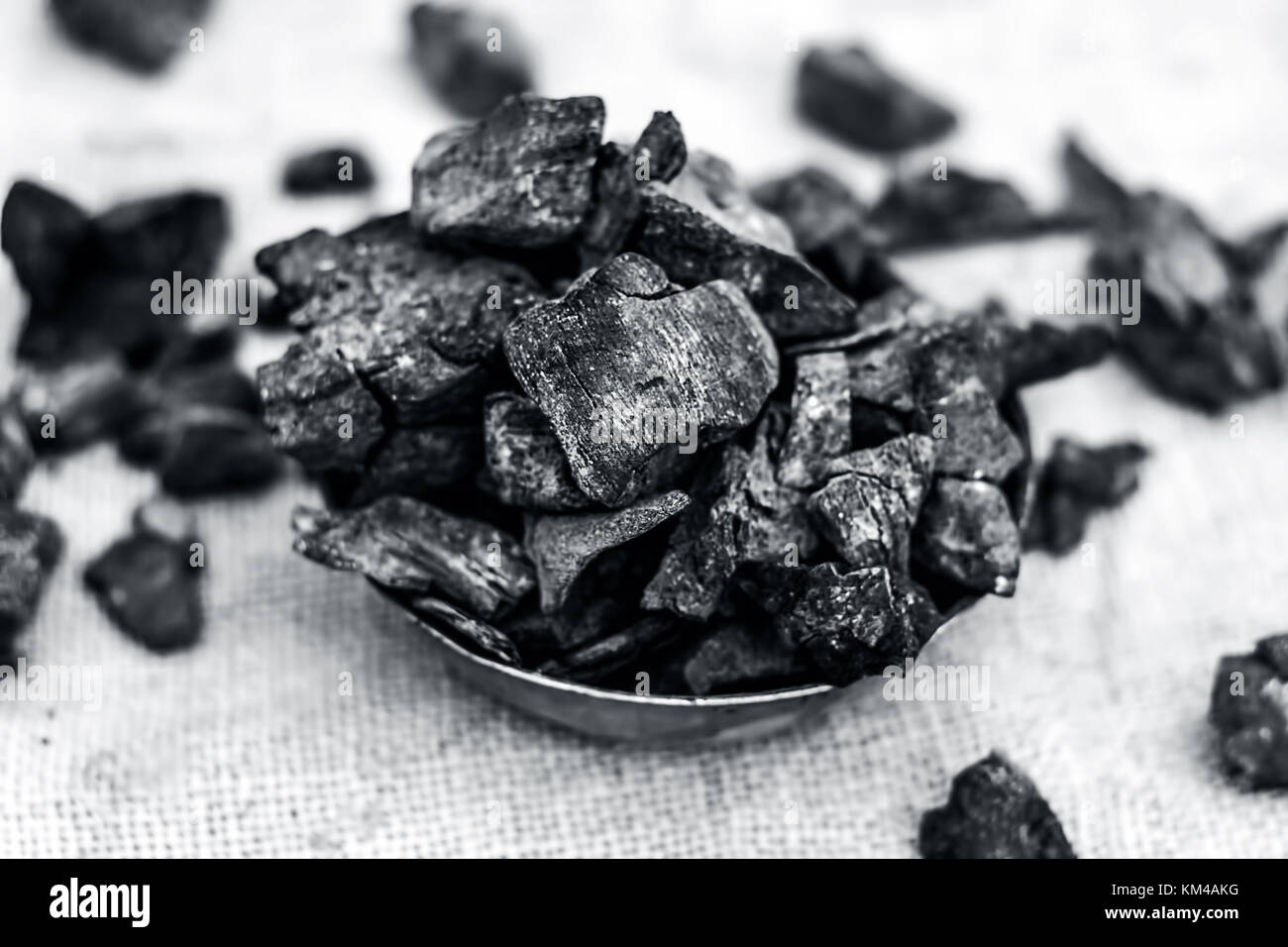 Coal in a rusted bowl on a gunny background Stock Photo - Alamy