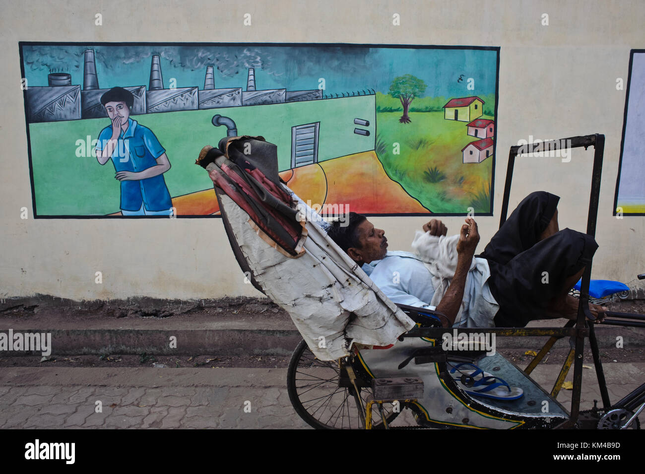 Anti pollution mural painting + cycle rickshaw puller taking rest ...