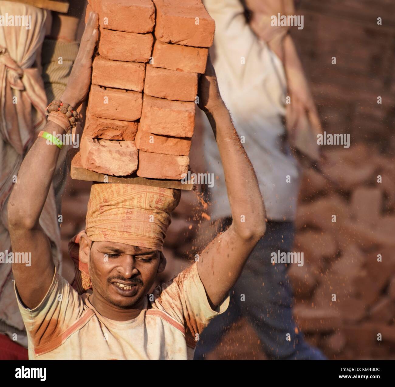 In heavy manual work brick stones are made in this brickyard near ...