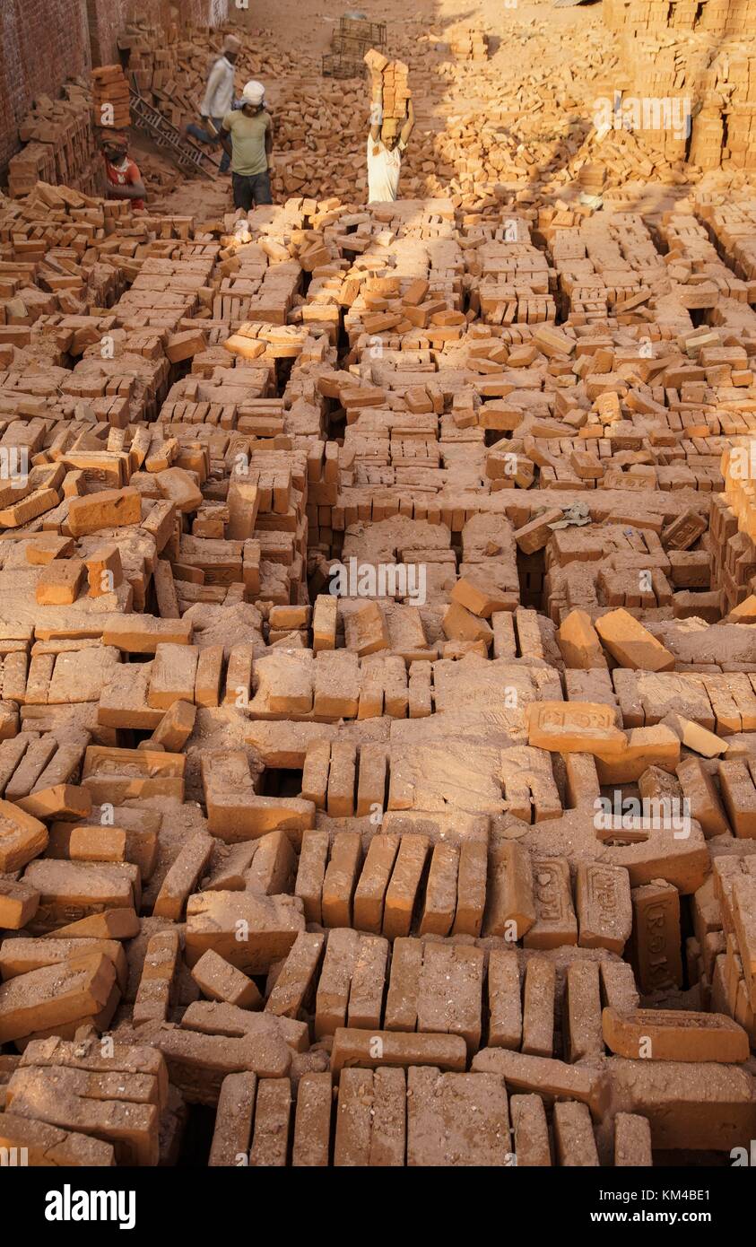 In heavy manual work brick stones are made in this brickyard near ...