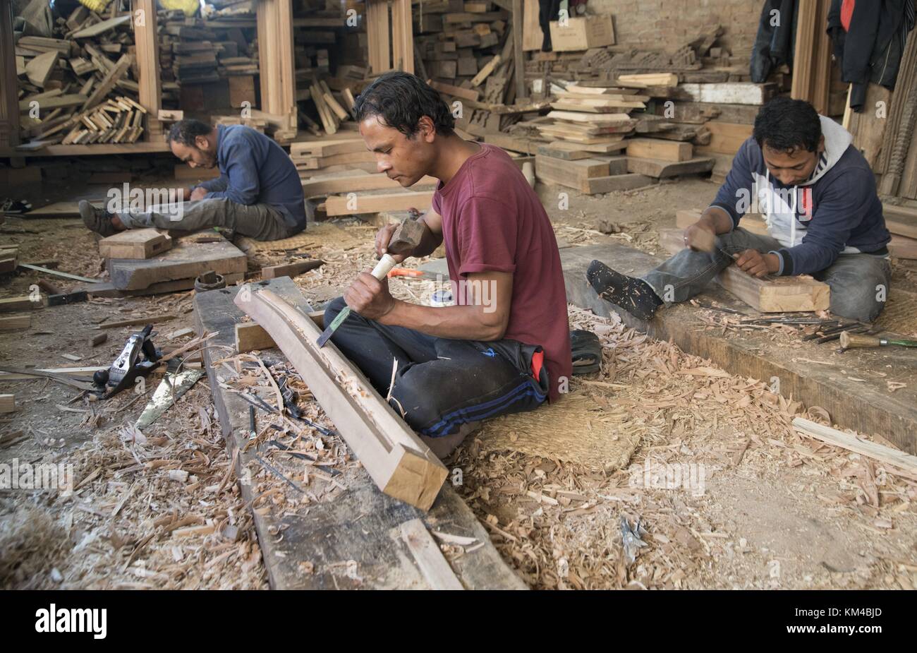 Three wood sculptors work in a workshop in Bhaktapur, established by ...